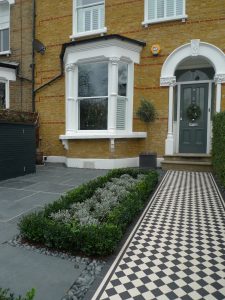 Yellow London brick wall black and white Victorian mosaic topiary ...